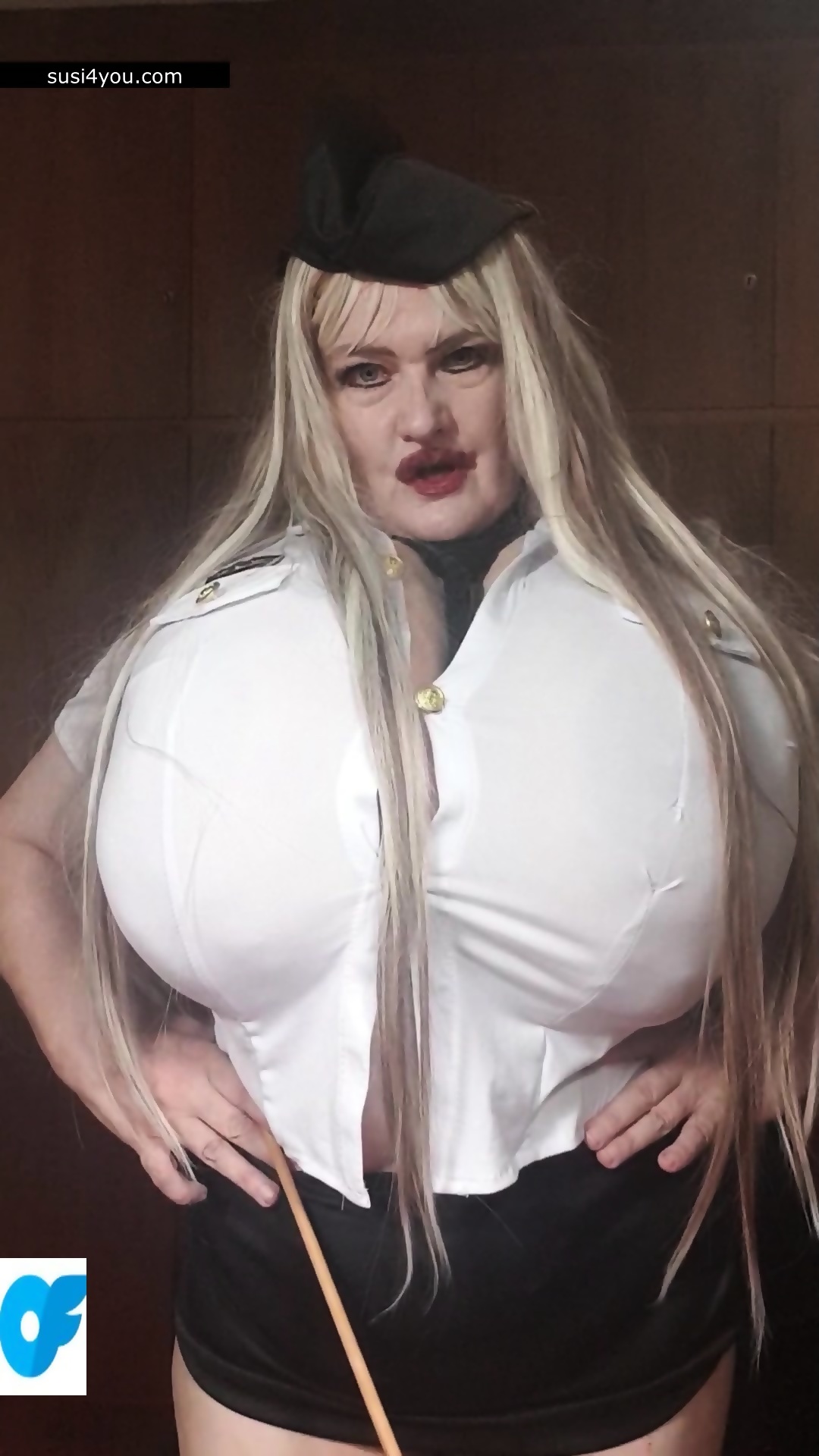 Wearing A Policecostume She Is Teasing With A Stick Showing Huge Tits